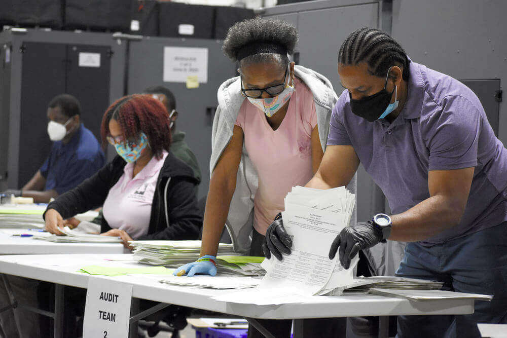 A conspiracy-fueled push to count ballots by hand gains traction ...